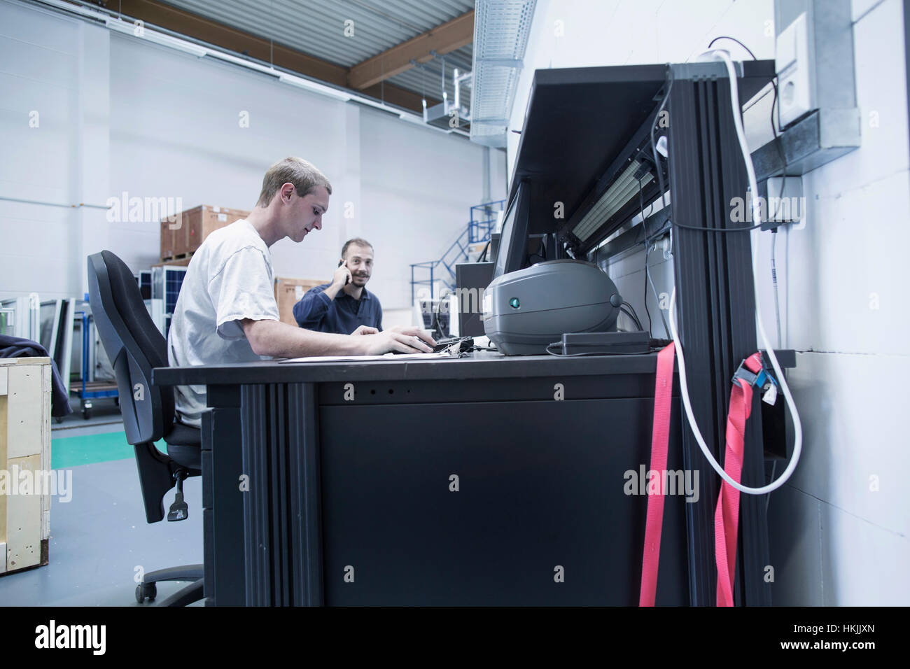 Store workers working on desktop pc, Freiburg im Breisgau, Baden ...
