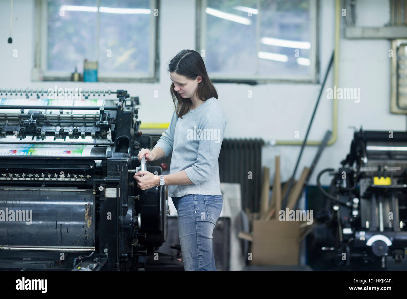 Print worker adjusting printing machine in an industry, Freiburg im ...