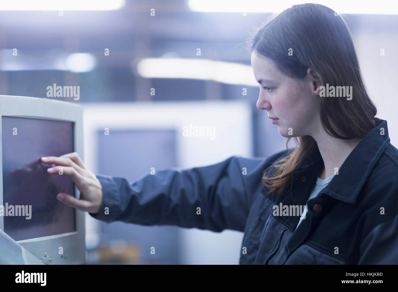 Print worker working at computer in an industry, Freiburg im Breisgau ...