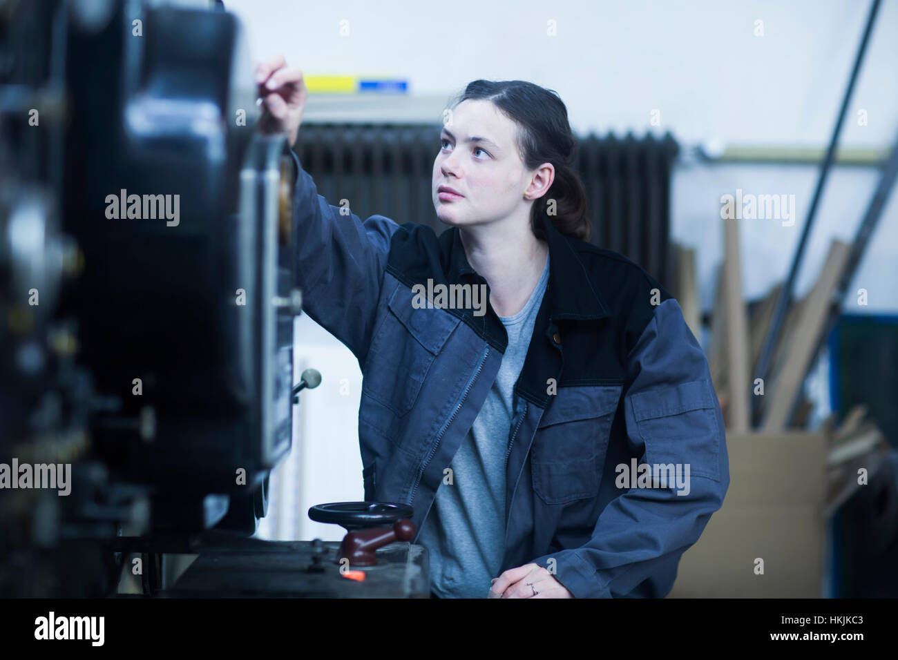 Print worker adjusting printing machine in an industry, Freiburg im ...