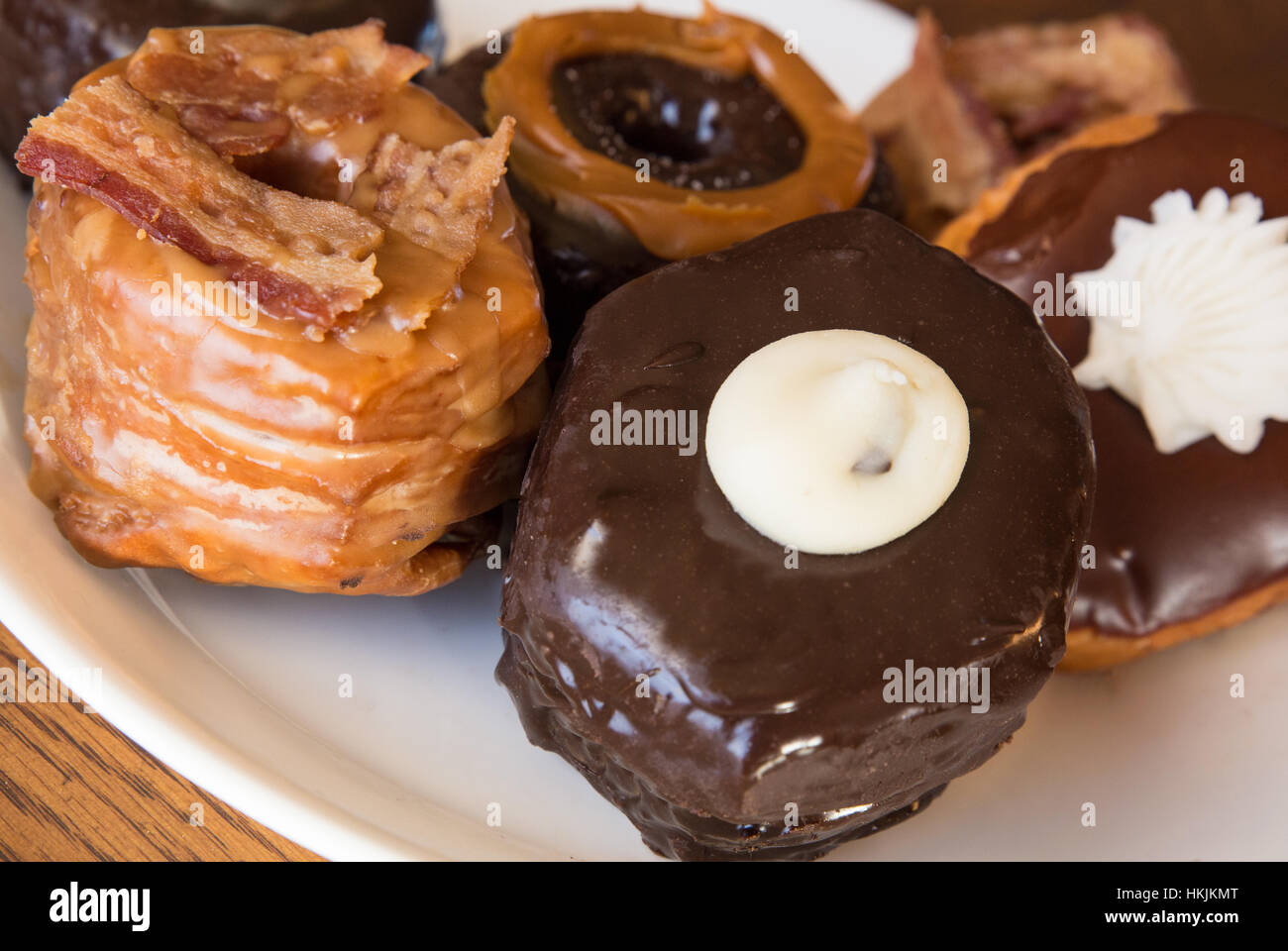 Platter of gourmet donuts assorted varieties Stock Photo - Alamy