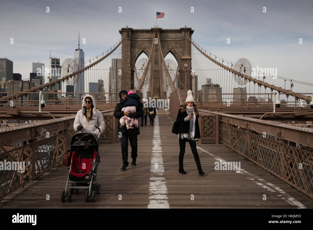 People walking in the winter from Lower Manhattan to Brooklyn across ...