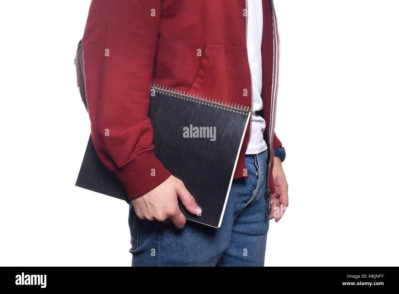 Portrait of young student holding notebook. Isolated white background ...