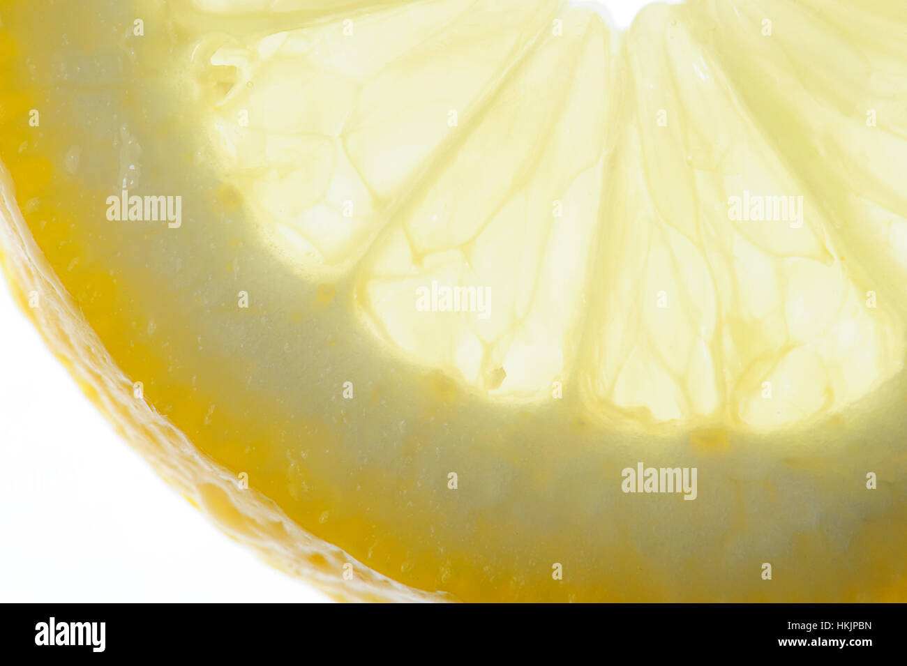 lemon slice yellow macro close up on white background Stock Photo - Alamy