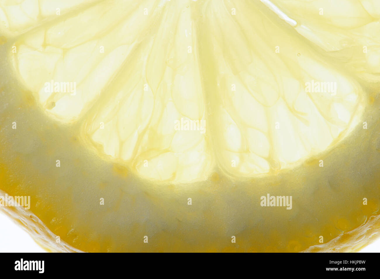 slice lemon macro close up on white background Stock Photo - Alamy