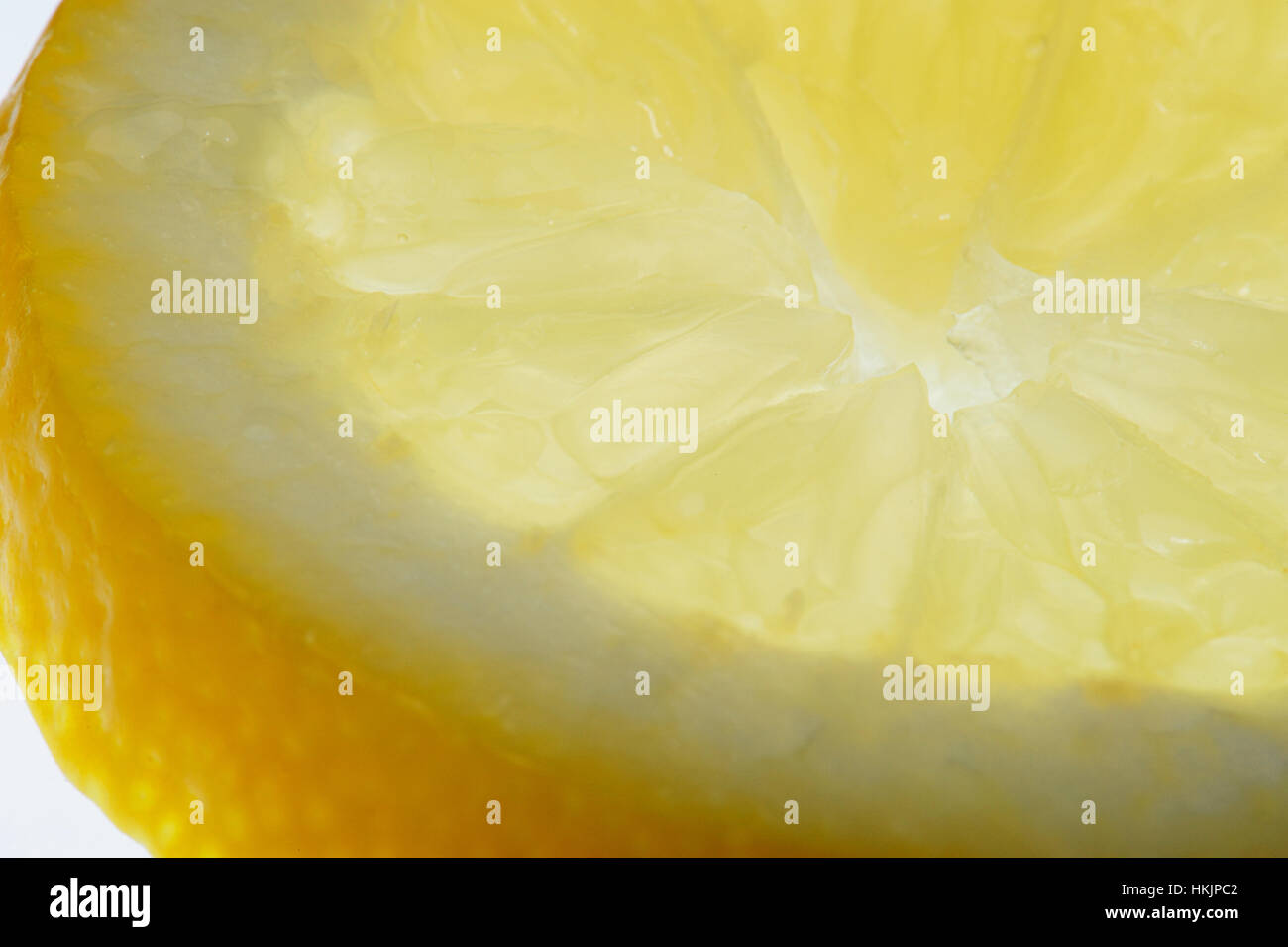 lemon slice cut macro close up on white background Stock Photo - Alamy