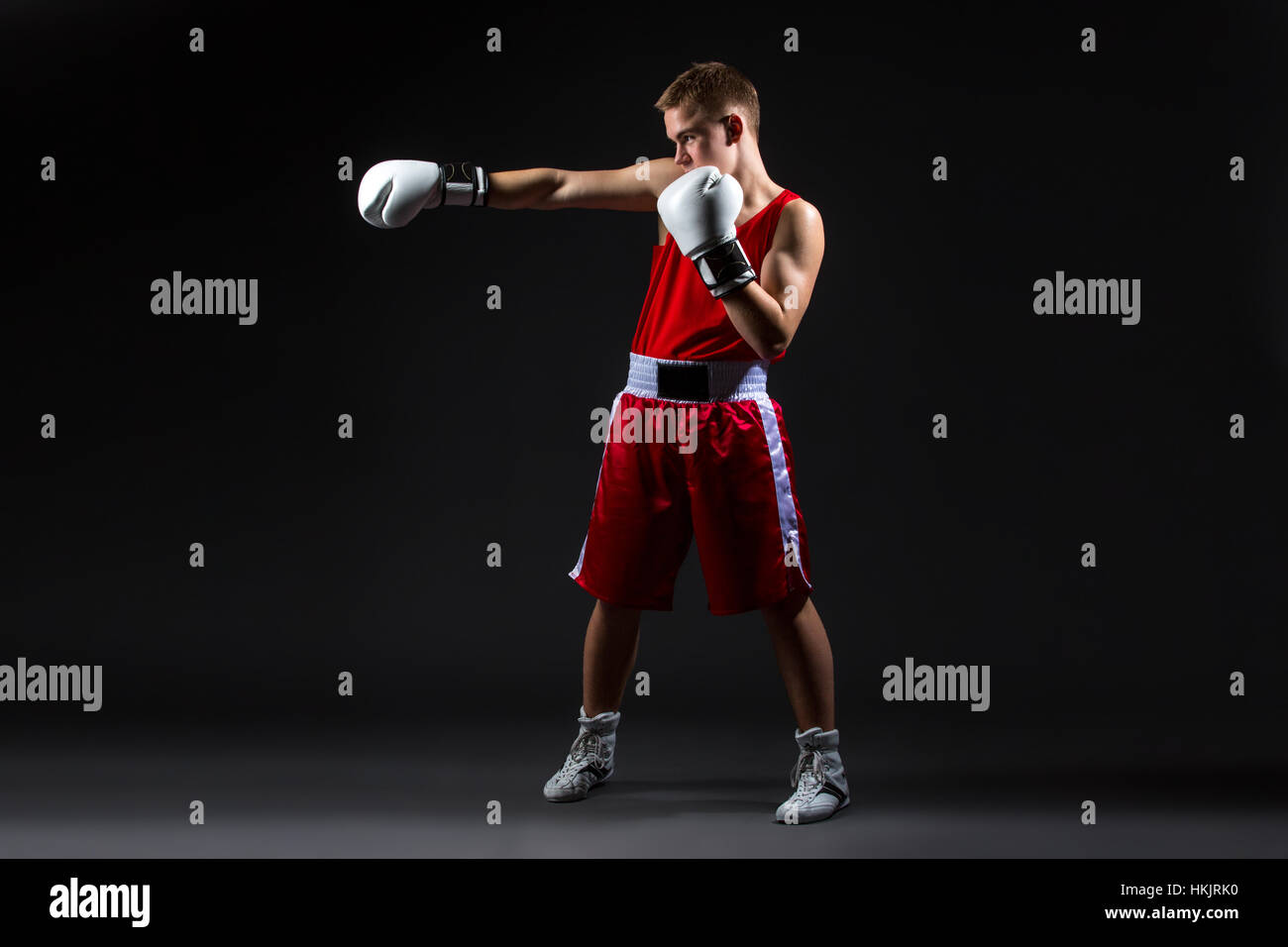 Young boxer sportsman in red sport suit Stock Photo - Alamy