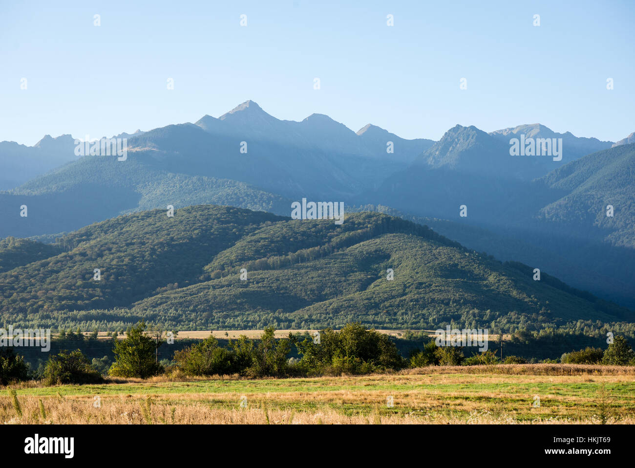 Winding country Road with clouds above and dry tarmac Stock Photo - Alamy