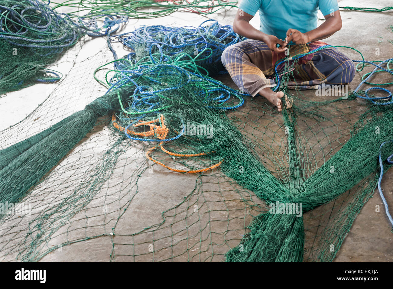 Fisherman repairing fishing net, Western Province, Sri Lanka Stock ...