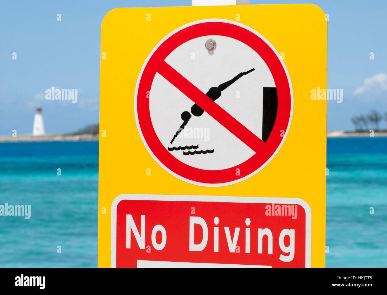 The warning sign prohibiting diving standing on Nassau city beach ...