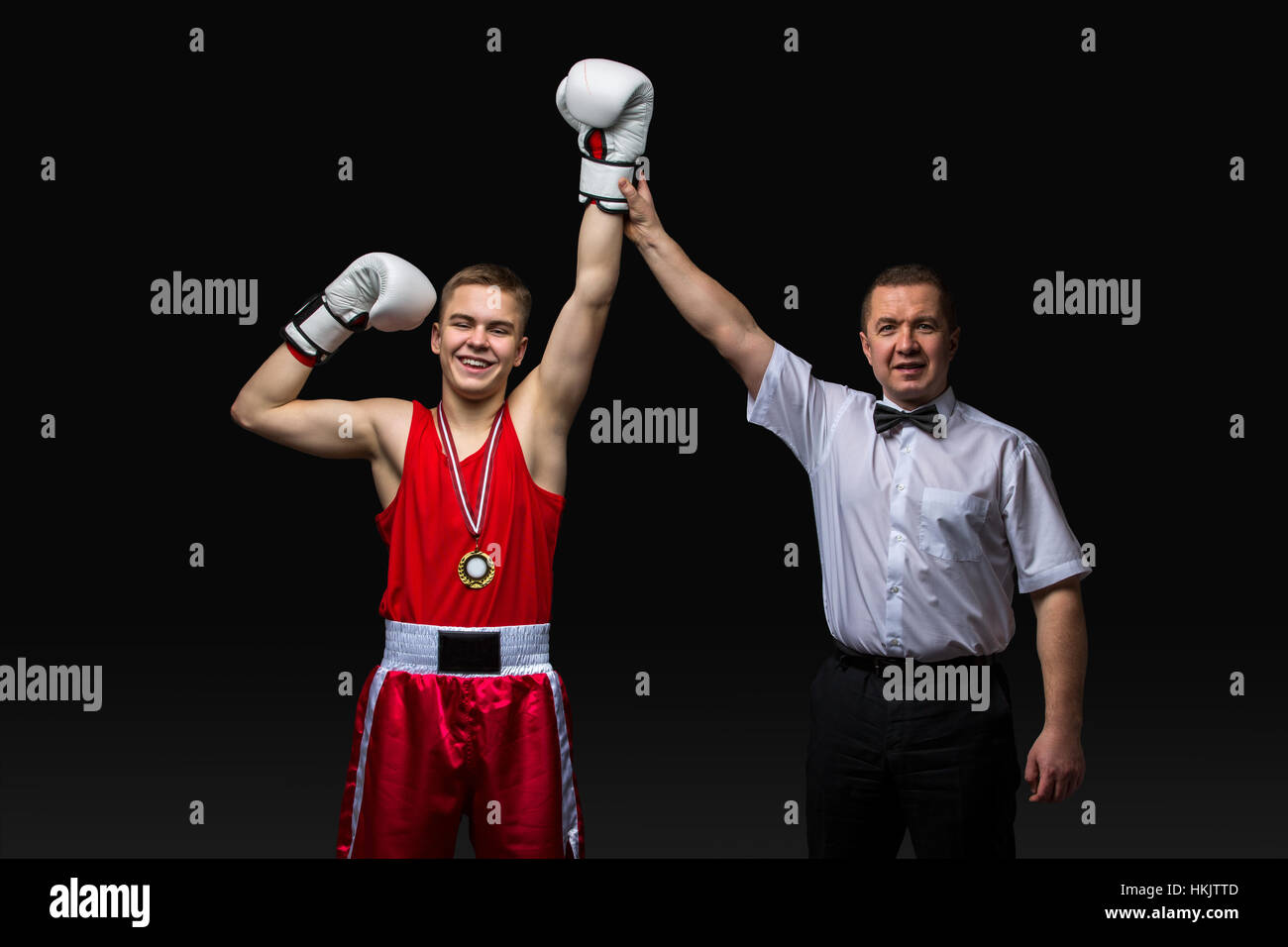 Boxing referee gives medal to young boxer Stock Photo - Alamy