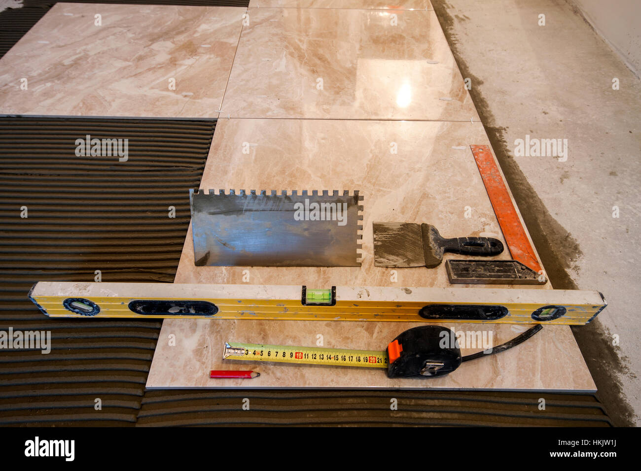 Ceramic tiles and tools for tiler. Floor tiles installation. Home ...