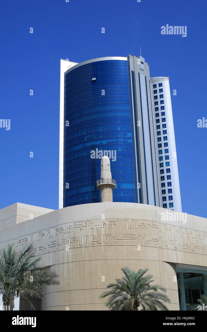 Minaret of the Beit al-Quran seen against the facade of a modern high ...