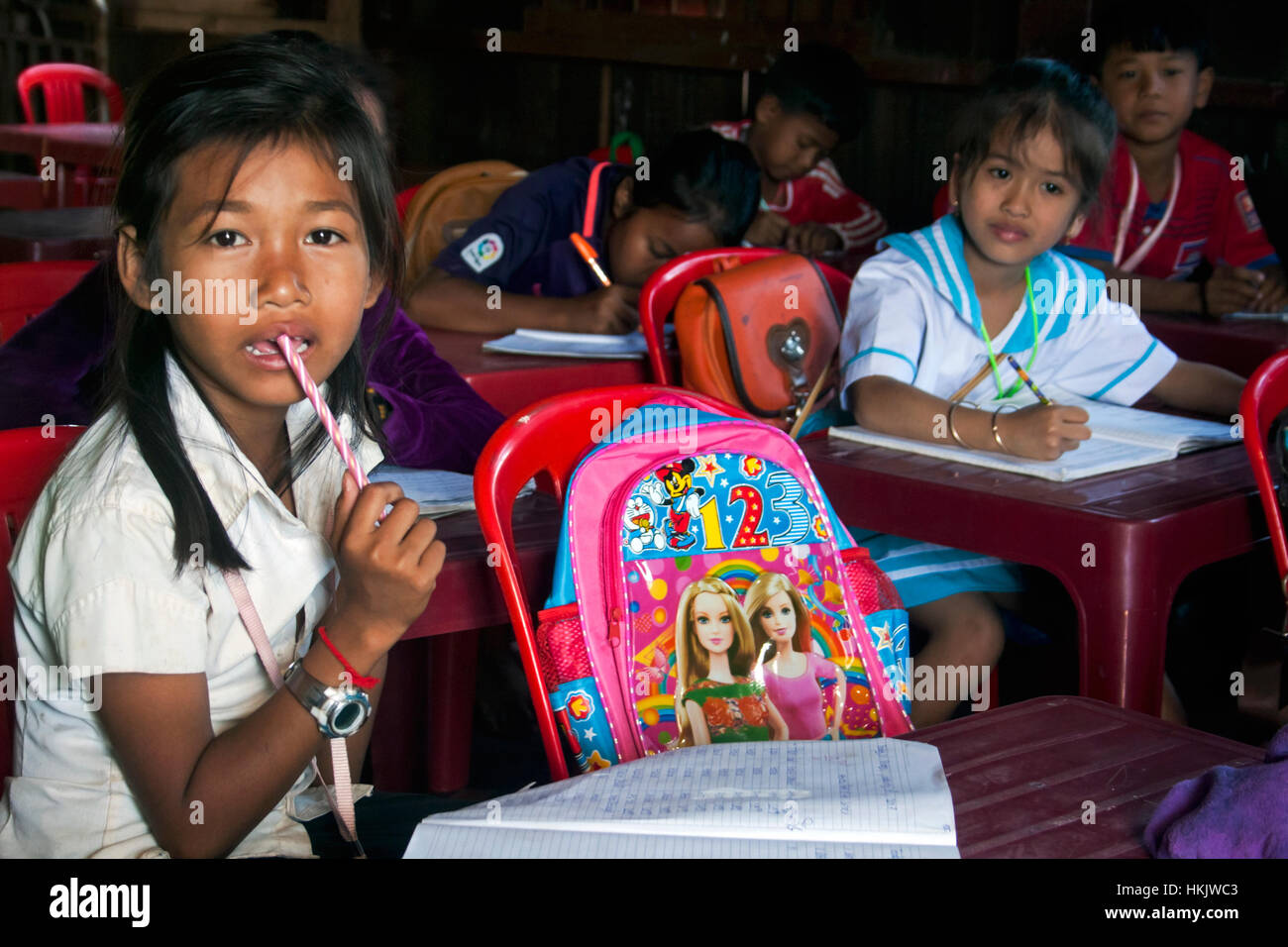 A 10 year old Asian girl is thinkng an English language school in Chok ...