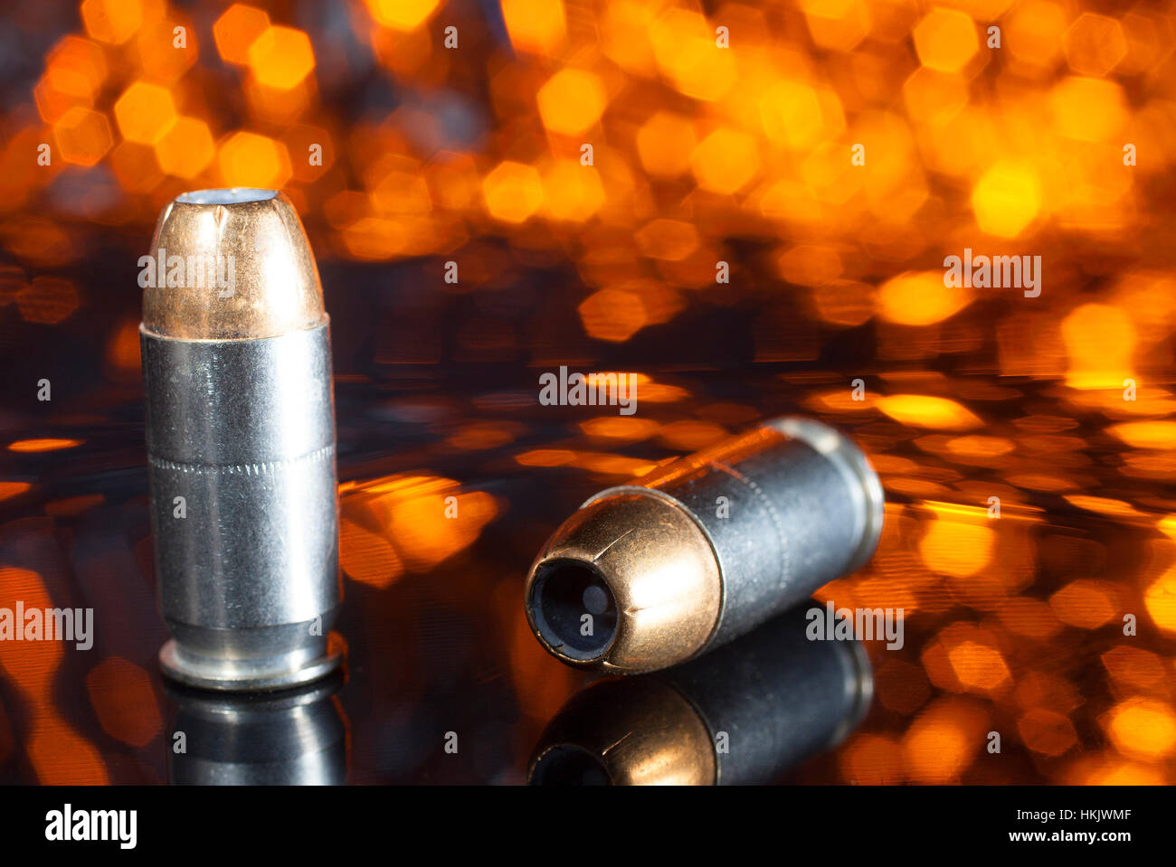 Cartridges for a handgun with hollow point bullets and an orange ...