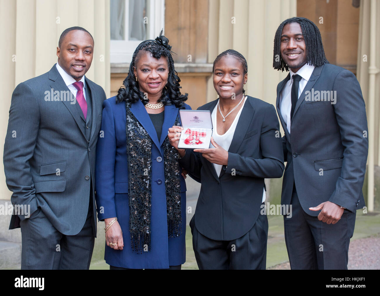Receiving medal majesty hi-res stock photography and images - Alamy