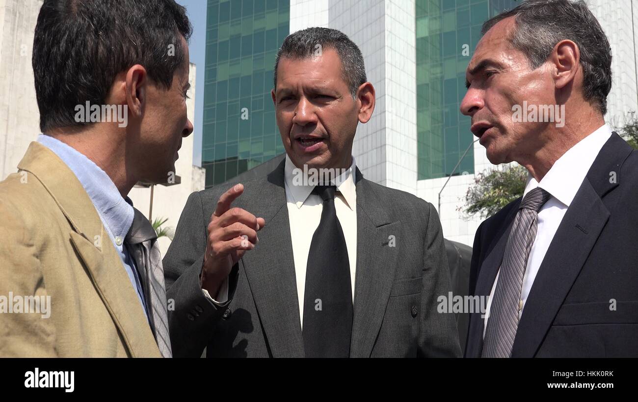 Hispanic Business Men Talking Stock Photo - Alamy