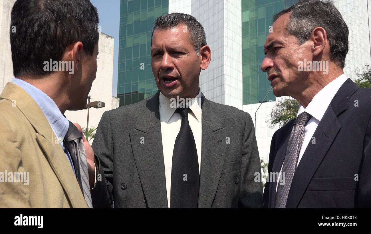 Hispanic Business Men Talking Stock Photo - Alamy