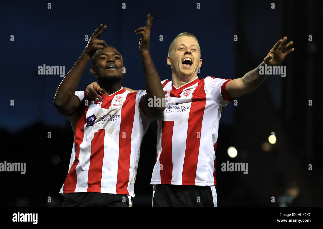 Lincoln's Theo Robinson (left) celebrates scoring his sides third goal ...