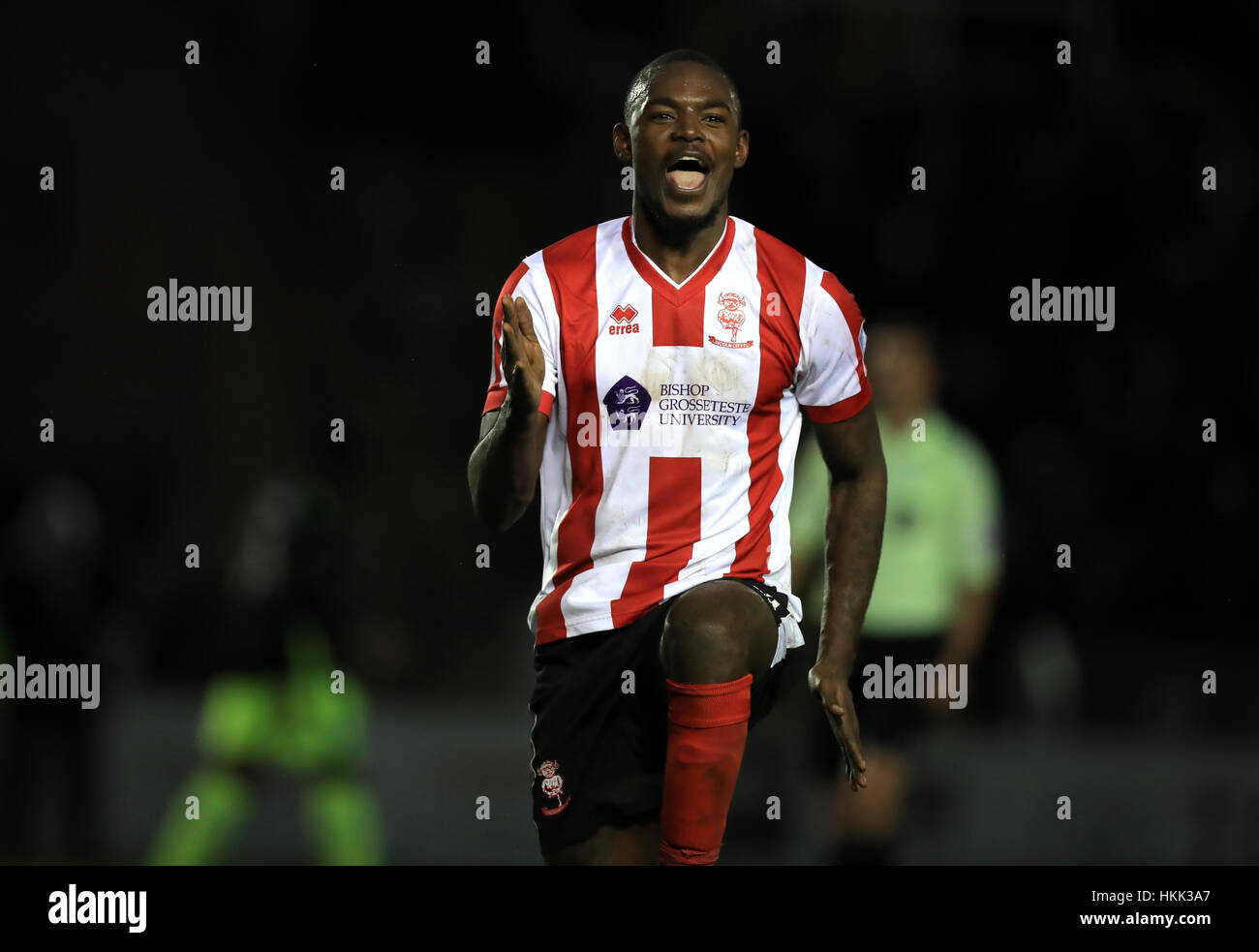 Lincoln's Theo Robinson (left) celebrates scoring his sides third goal ...