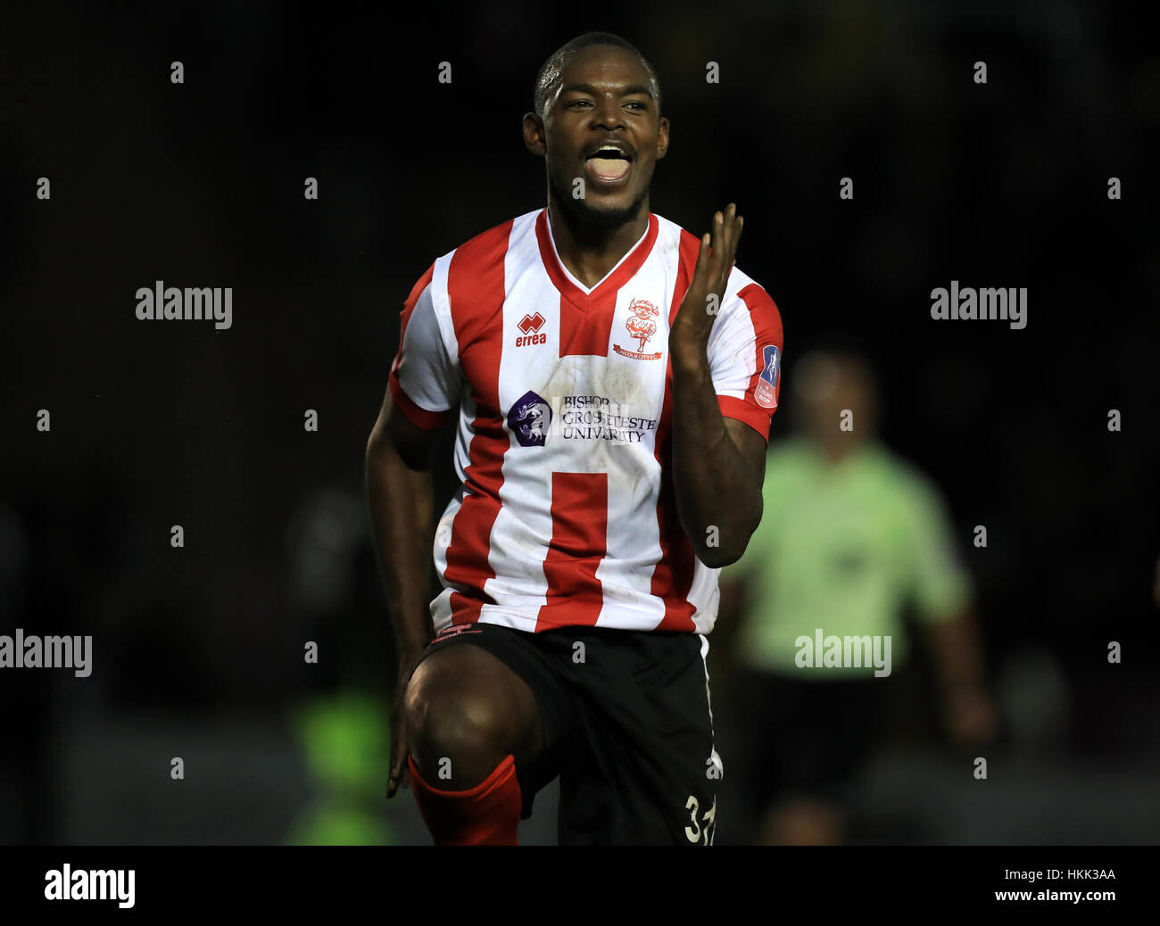 Lincoln's Theo Robinson (left) celebrates scoring his sides third goal ...