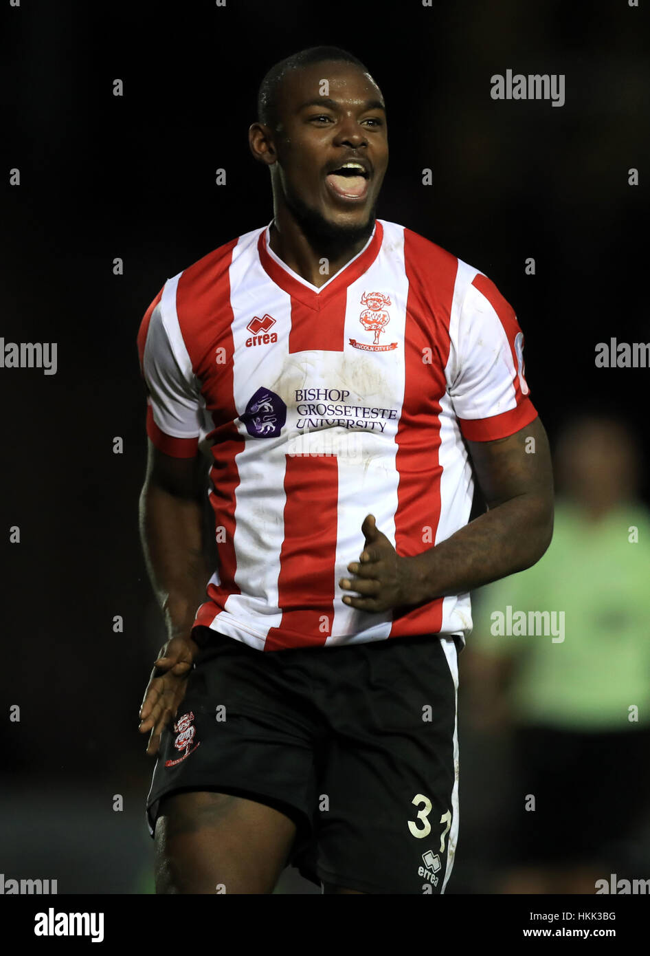 Lincoln's Theo Robinson (left) celebrates scoring his sides third goal ...