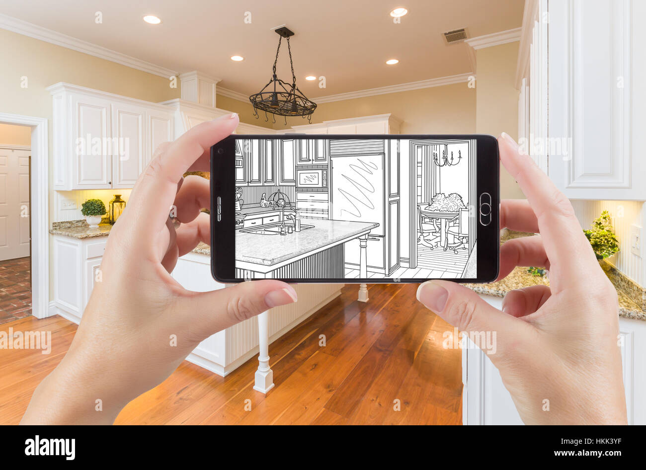 Hands Holding Smart Phone Displaying Drawing of Custom Kitchen Photo ...