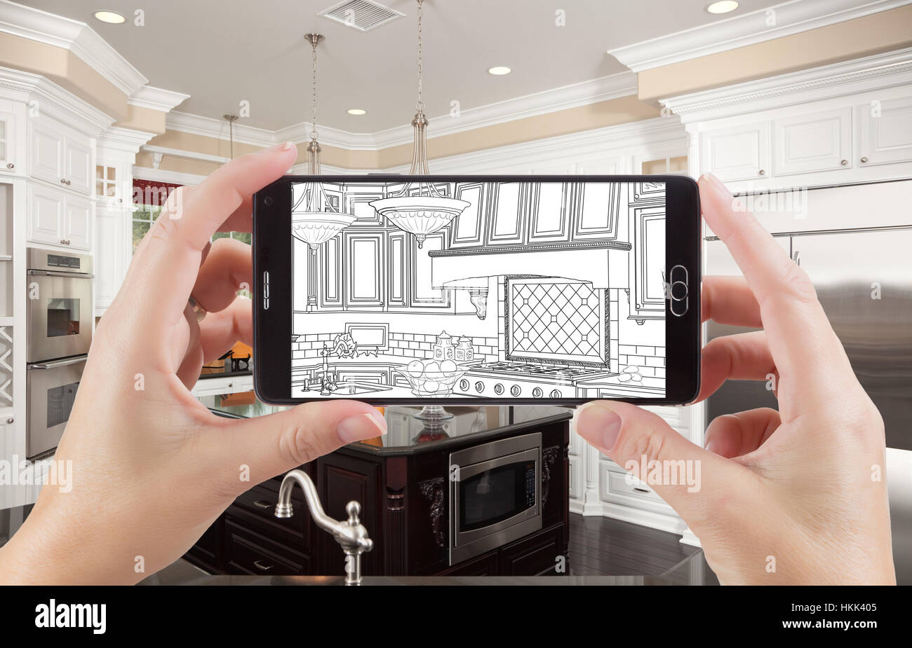 Female Hands Holding Smart Phone Displaying Drawing of Custom Kitchen ...