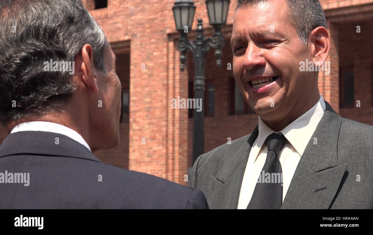 Happy Business Men Talking Stock Photo - Alamy