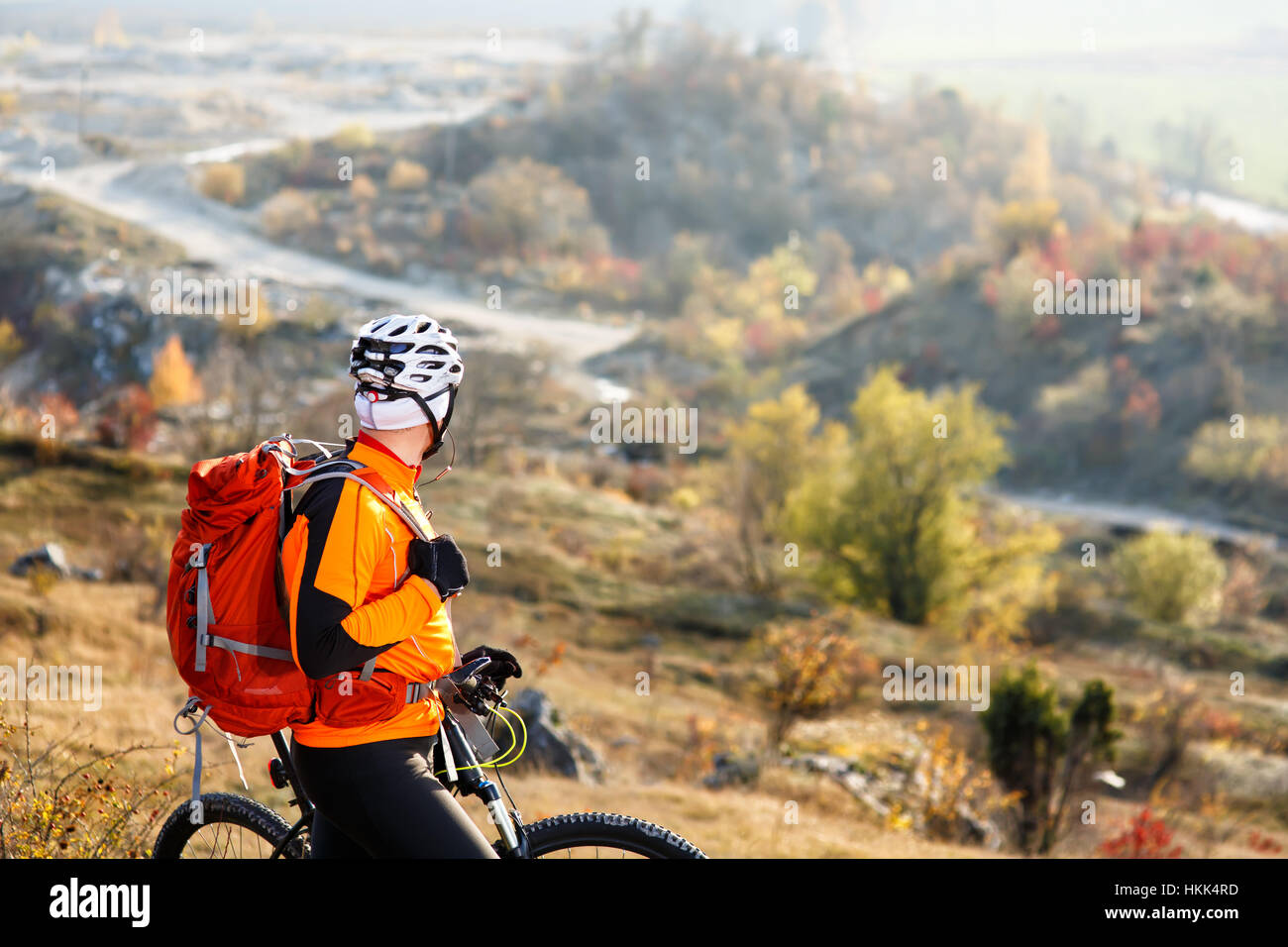 Bike cyclist with red backpack riding single track Stock Photo - Alamy
