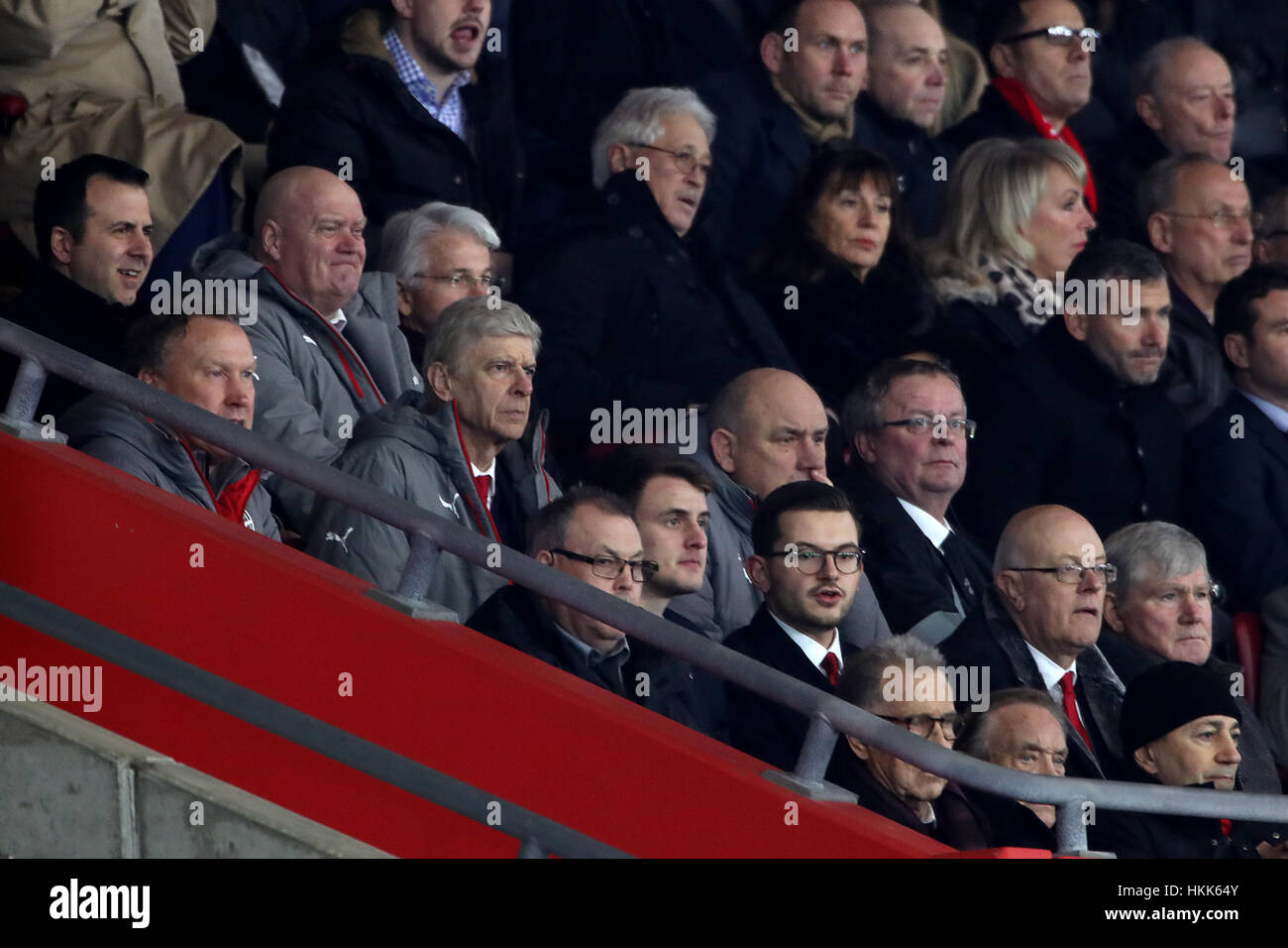 Arsenal manager Arsene Wenger (left of centre) watches from the stands ...