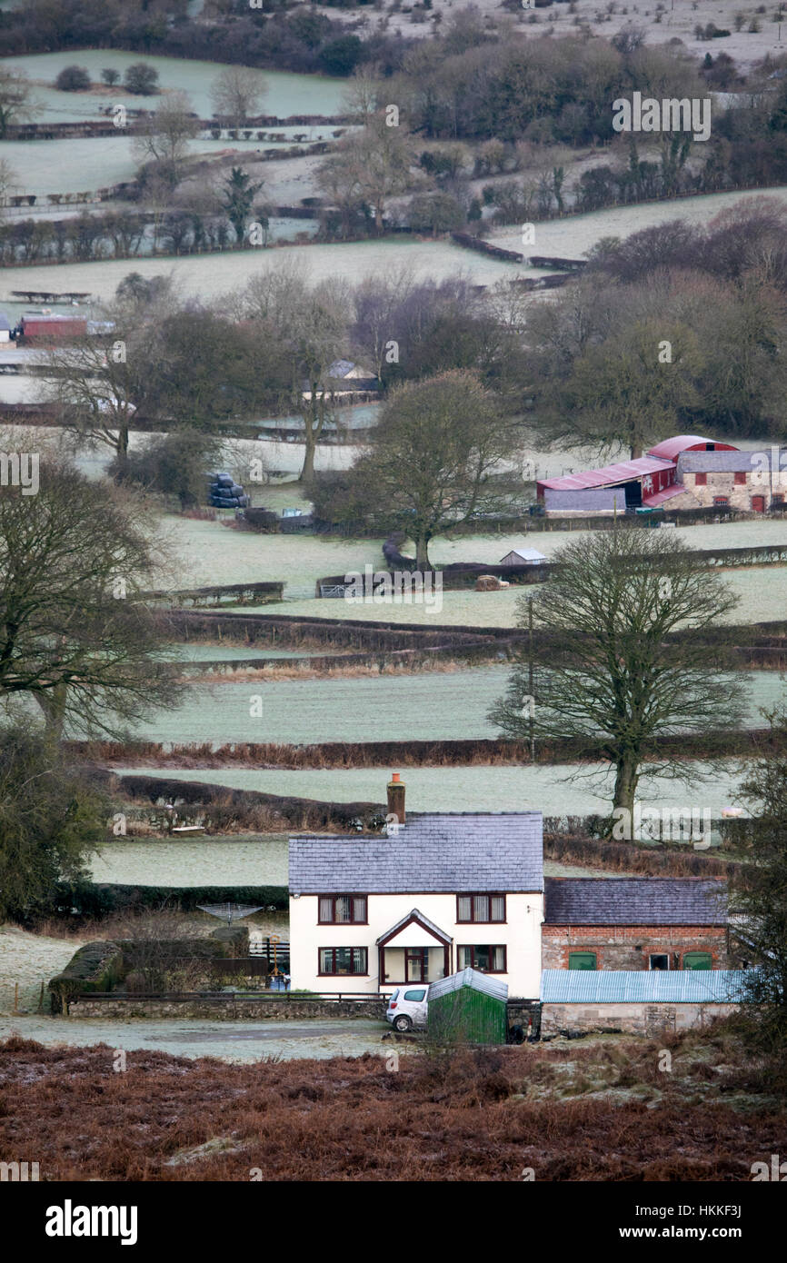 Rural farm house surrounded by frozen fields during a morning frost ...