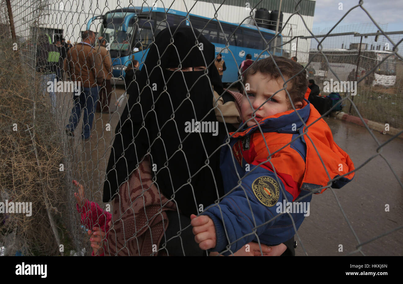 Gaza, Gaza Strip. 29th Jan, 2017. A Palestinian woman holds her son as ...