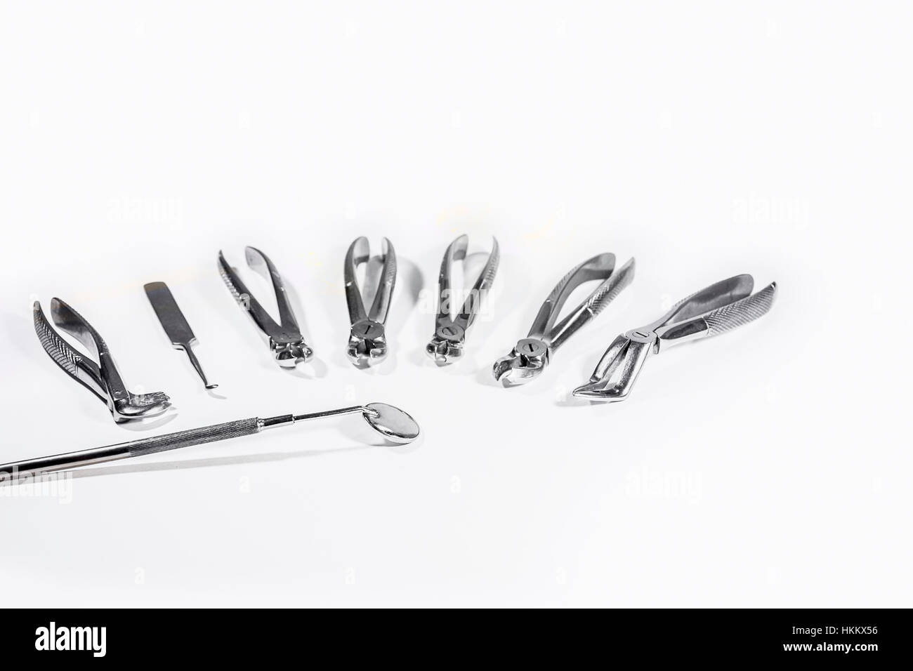 Dental Instruments arranged on white table.isolated on white.concept of ...