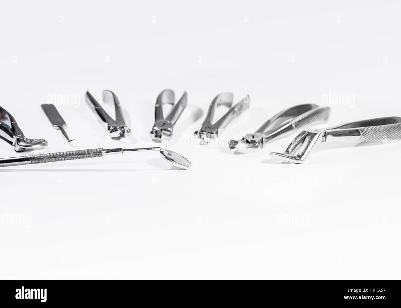 Dental Instruments arranged on white table.isolated on white.concept of ...