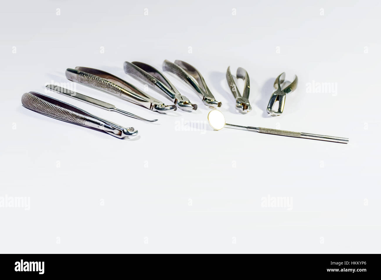 Dental Instruments arranged on white table.isolated on white.concept of ...