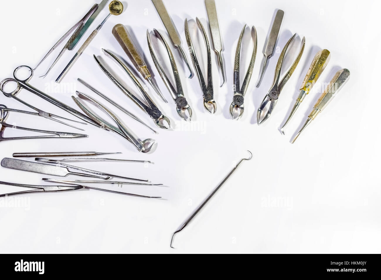 Dental Instruments arranged on white table.isolated on white.concept of ...