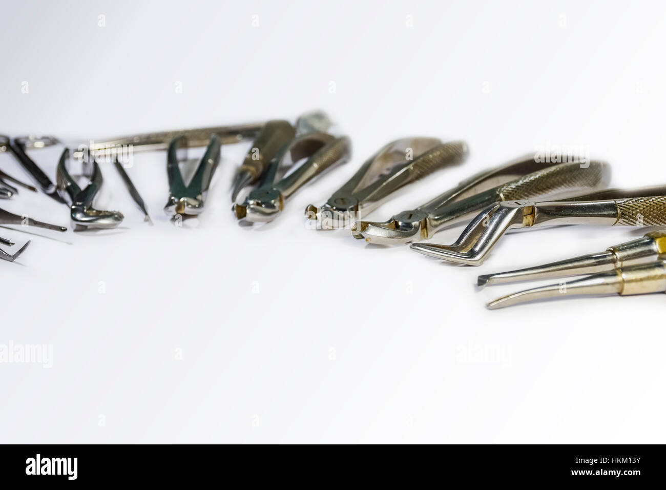 Dental Instruments arranged on white table.isolated on white.concept of ...
