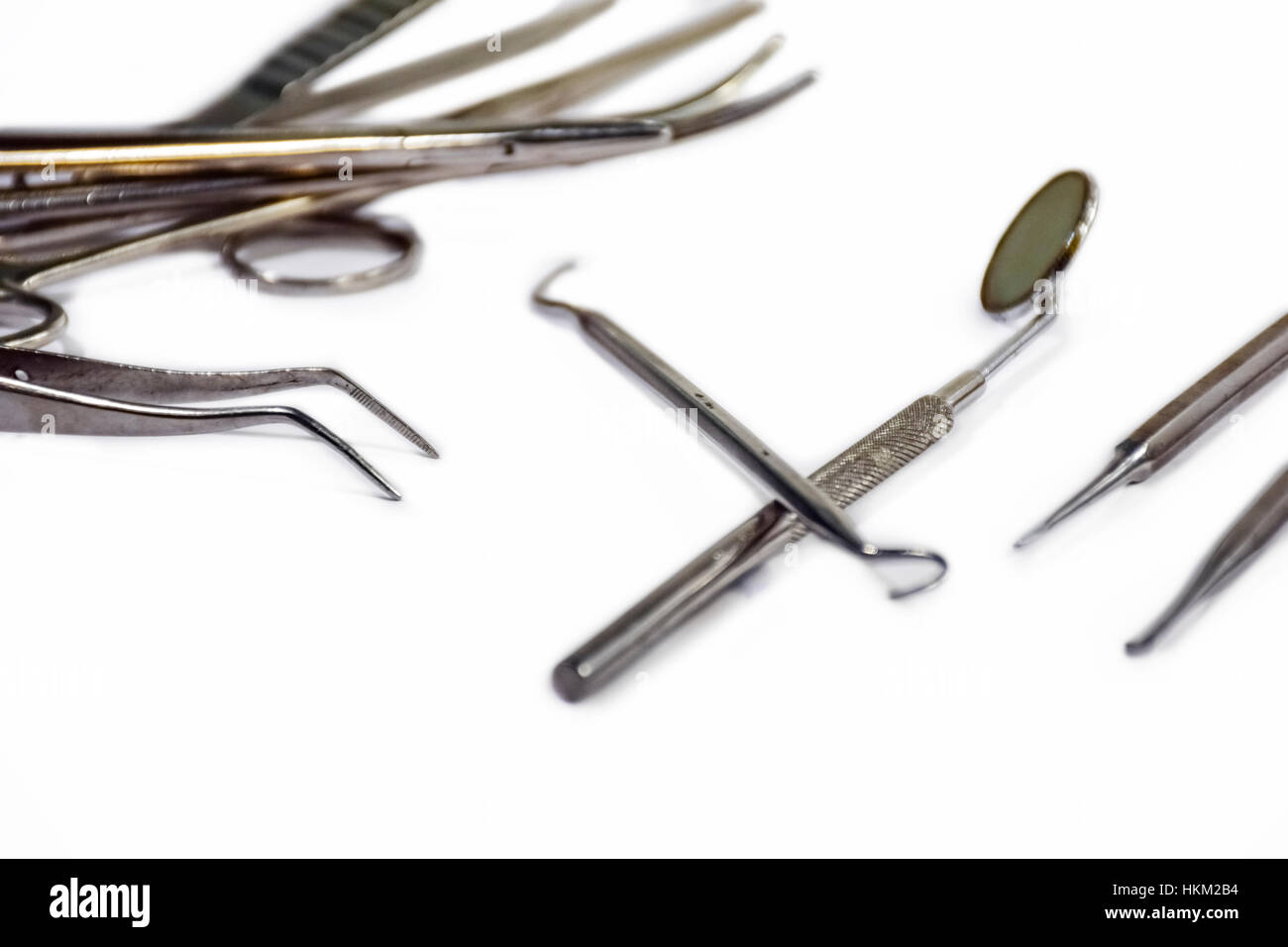 Dental Instruments arranged on white table.isolated on white.concept of ...