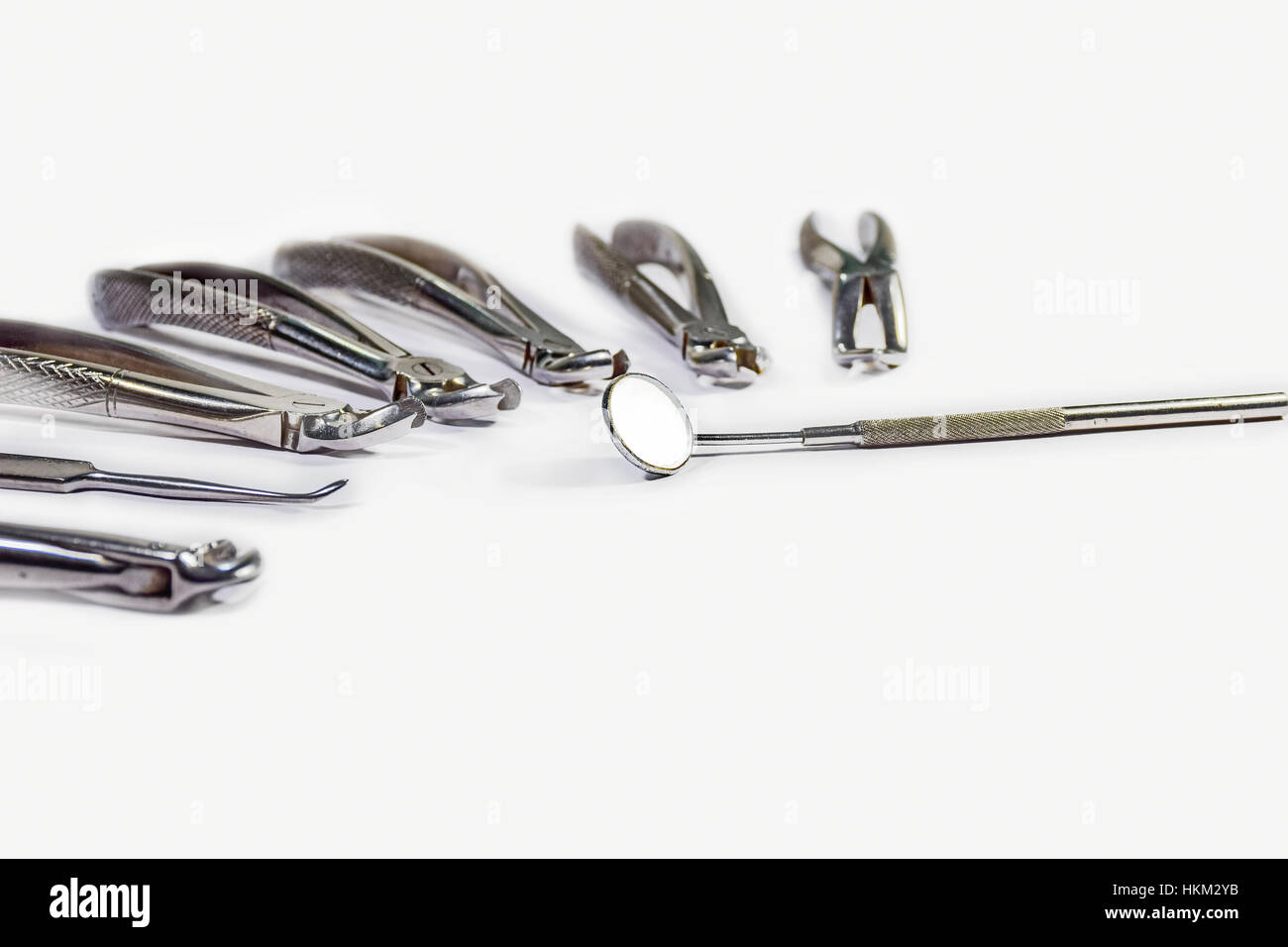 Dental Instruments arranged on white table.isolated on white Stock ...