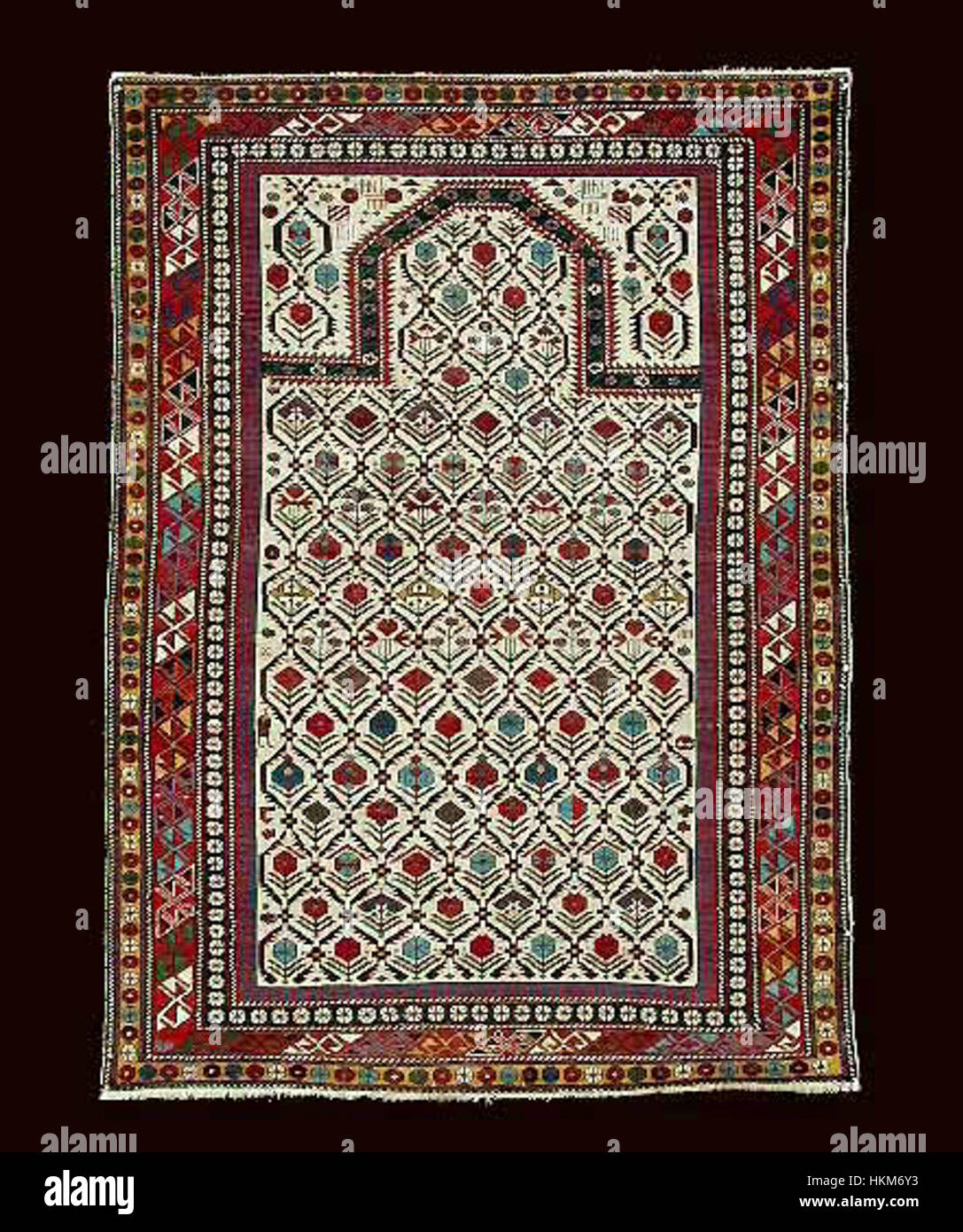 This image displays an Armenian carpet with a cross design, showcasing ...