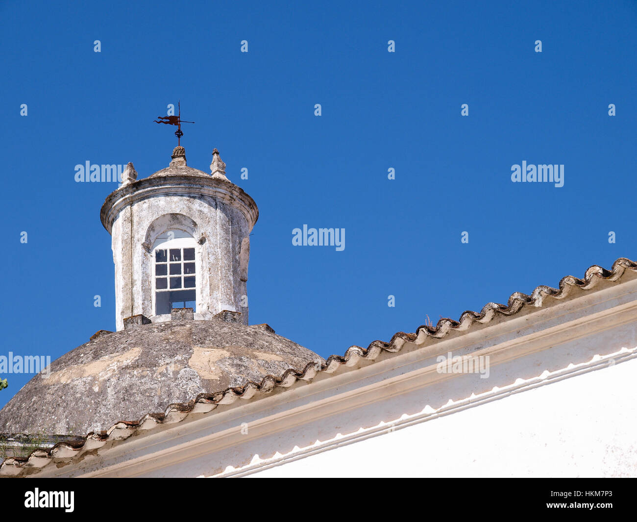 Tower of a church in Tavira, Portugal Stock Photo - Alamy