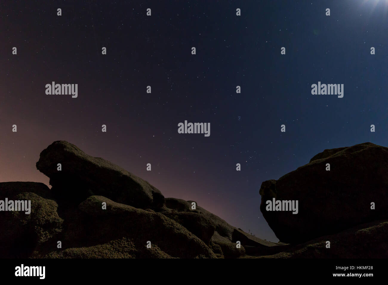 Nigh scene with rocks and stars Stock Photo - Alamy