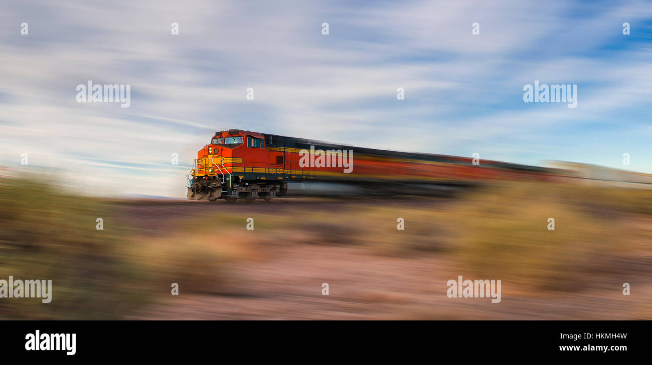Freight train ride at high speed through the desert Stock Photo - Alamy