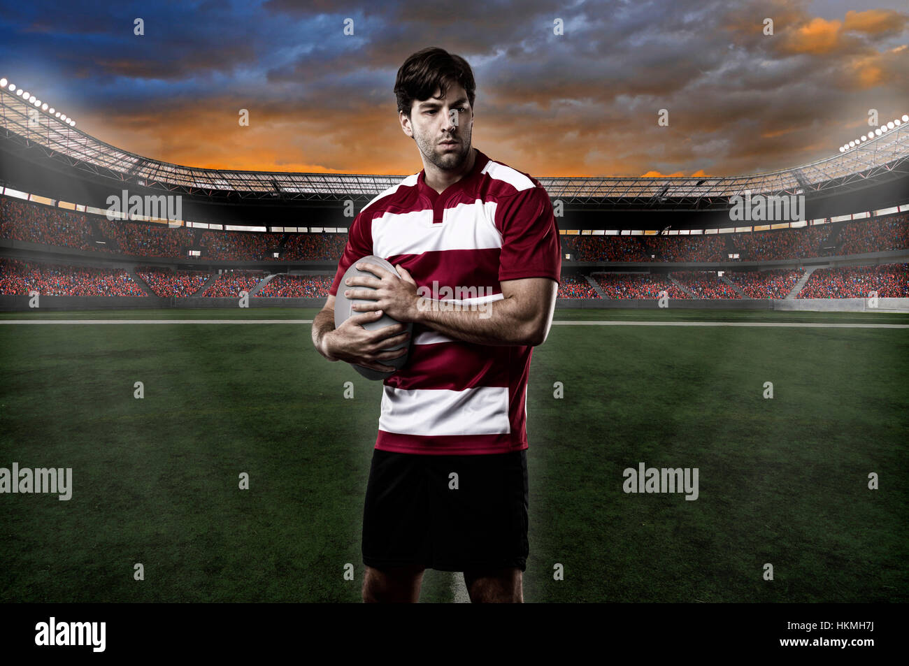 Rugby player in a red uniform. White Background Stock Photo - Alamy