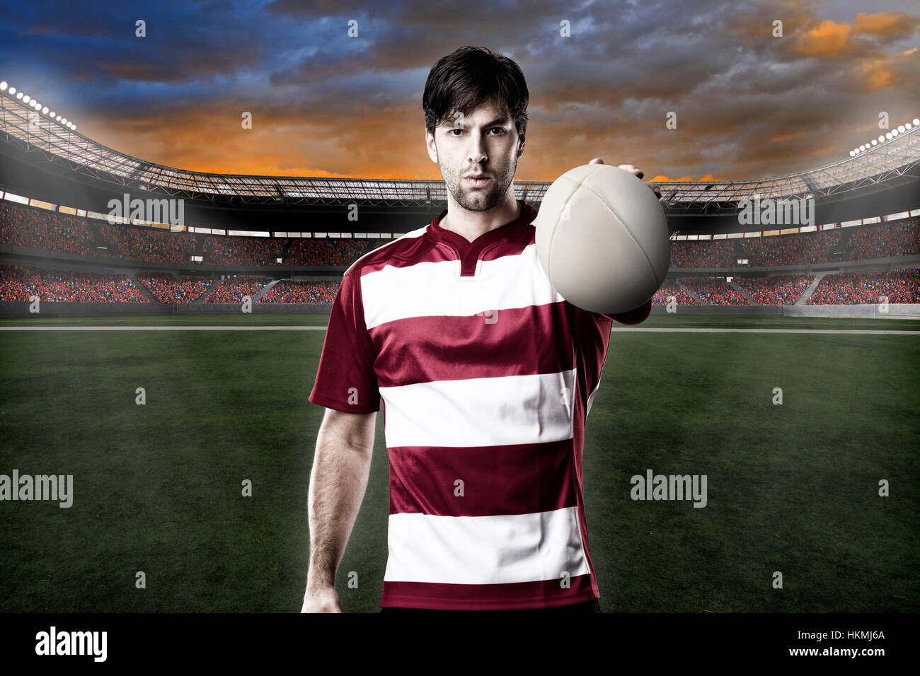 Rugby player in a red uniform. White Background Stock Photo - Alamy