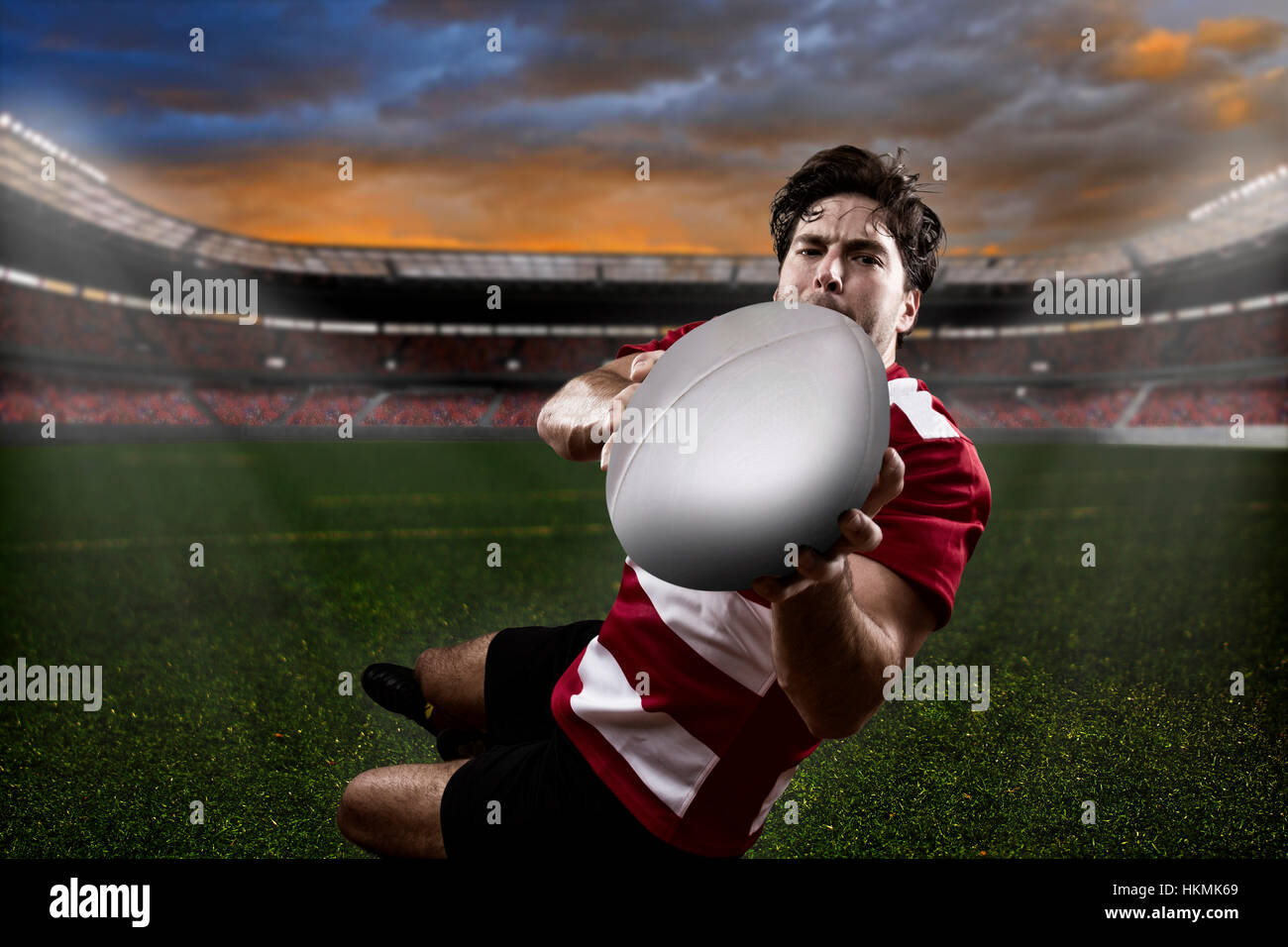 Rugby player in a red uniform. White Background Stock Photo - Alamy