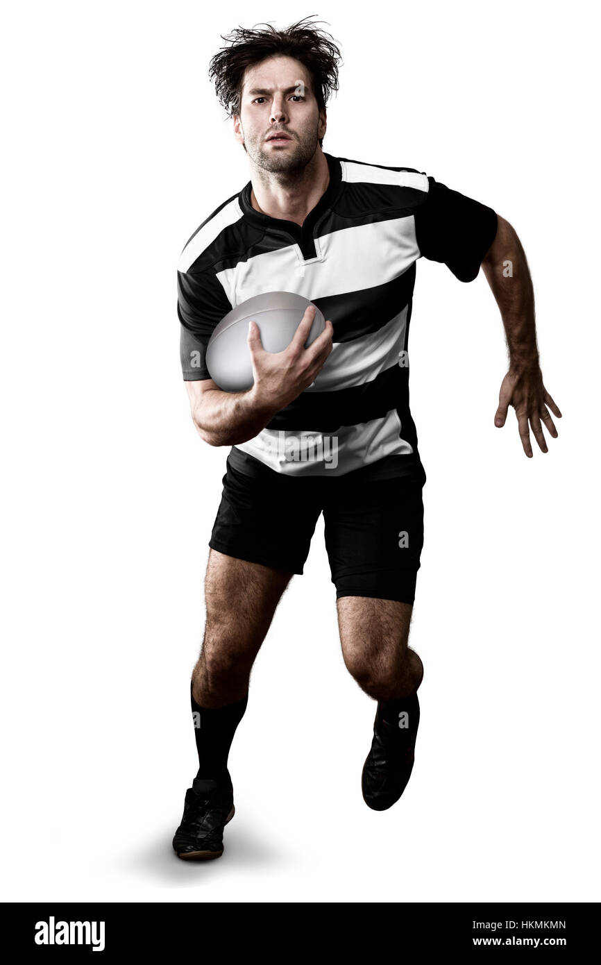 Rugby player in a red uniform running. White Background Stock Photo - Alamy