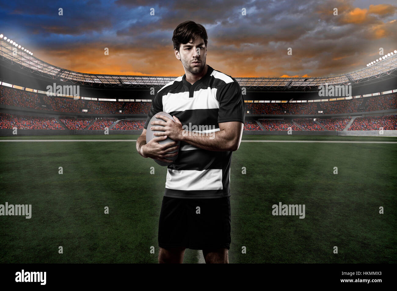 Rugby player in a black and white uniform. on a stadium Stock Photo - Alamy