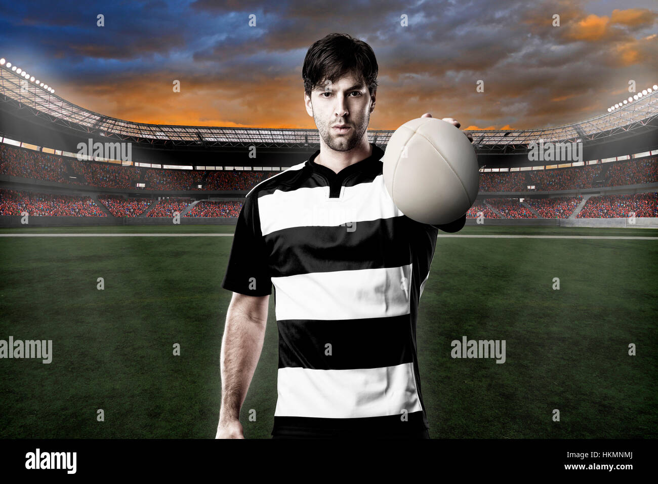 Rugby player in a black and white uniform on a stadium Stock Photo - Alamy
